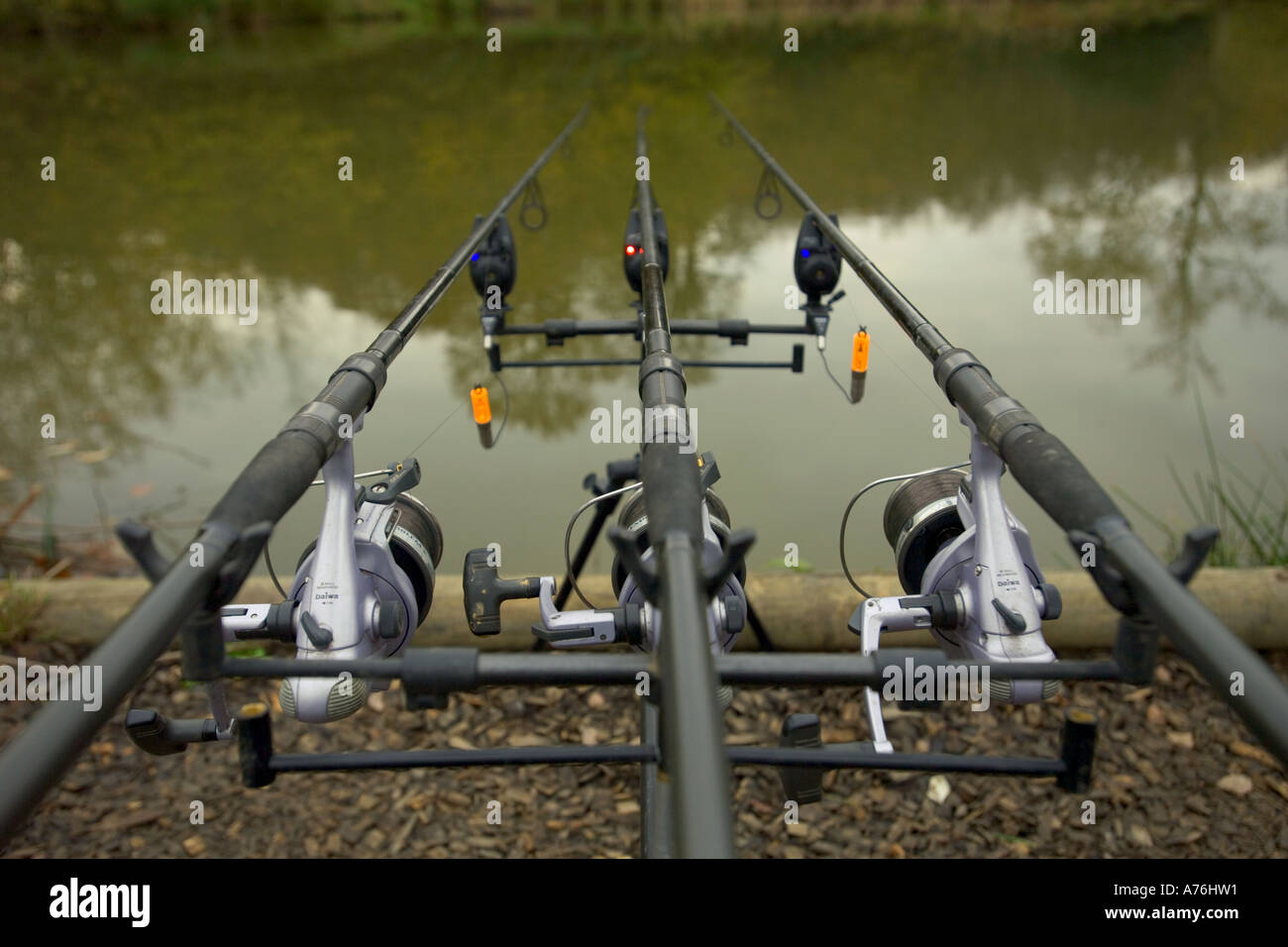 Fishing rods set up next to a fresh water lake waiting for a bite Stock ...