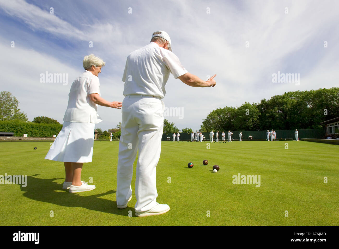Team members giving advice to the bowler during a game Stock Photo - Alamy