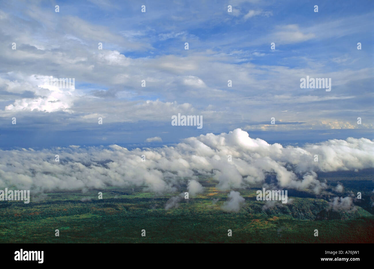 A view of the clouds and terrain from a microlite aircraft flying ...
