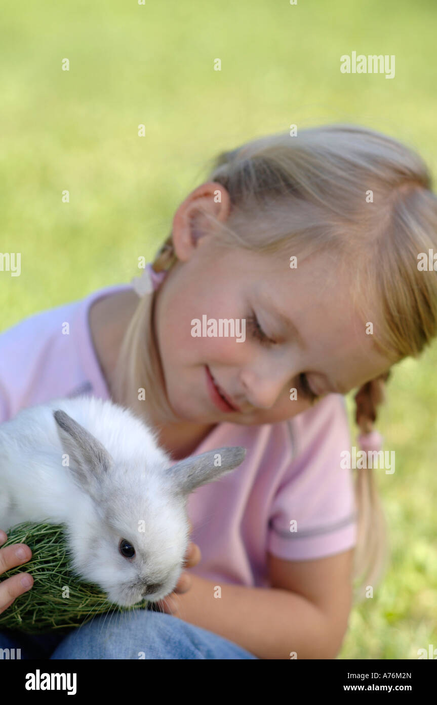 Girl holding easter bunny Stock Photo - Alamy