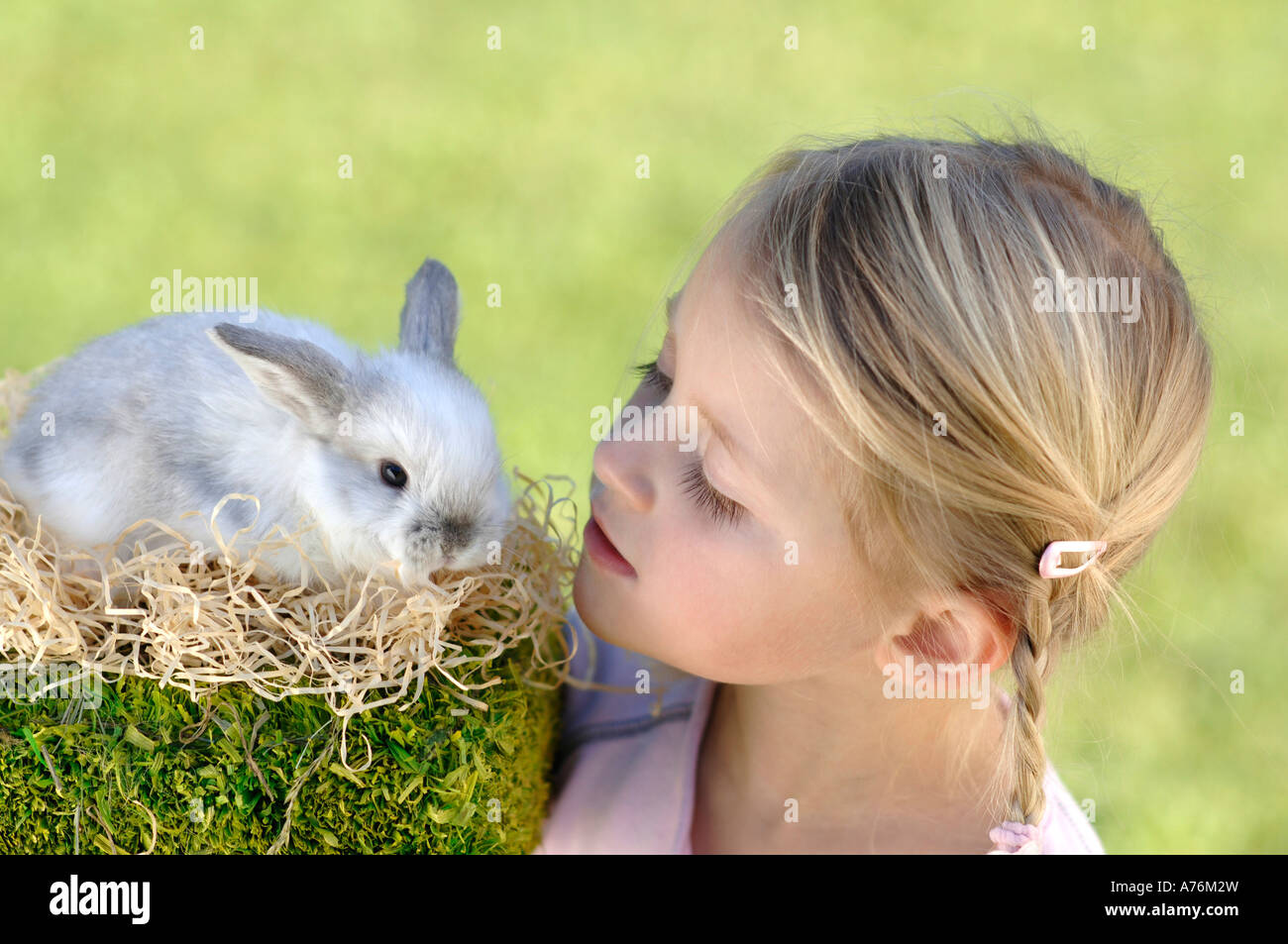Girl looking at easter bunny, close-up, portrait Stock Photo - Alamy