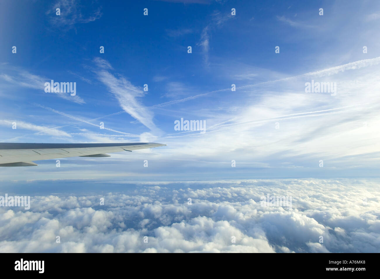 Aerial view of cumulus and cirrus cloud formations taken from a plane ...
