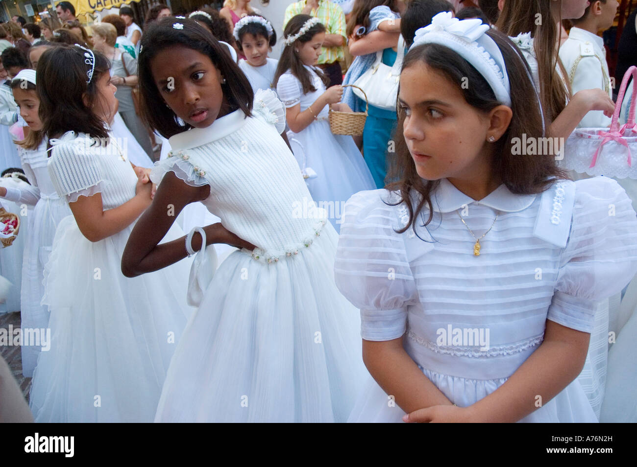 Girls wearing their communion dresses in Corpus Christi procession ...