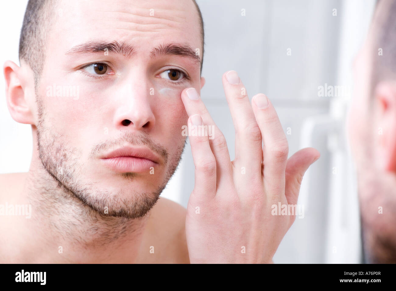 Man applying face cream, close-up Stock Photo - Alamy