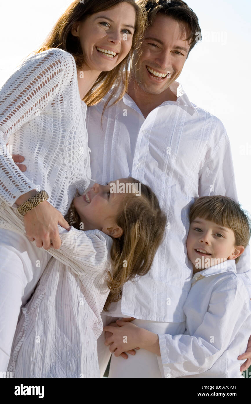 Children embracing parents, close-up Stock Photo - Alamy