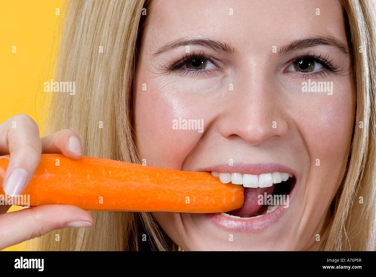 Woman eating bell pepper, close-up Stock Photo - Alamy