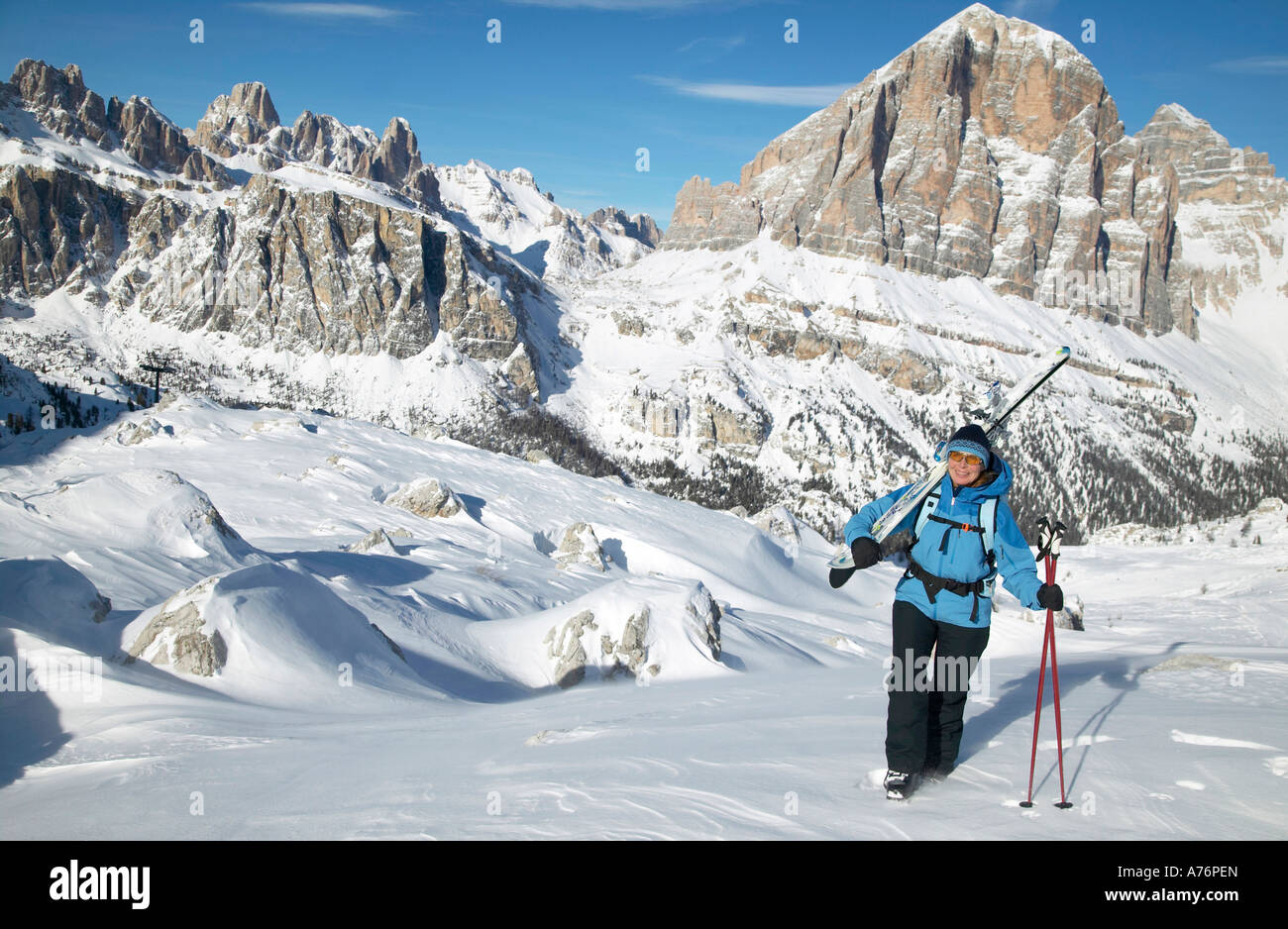 Italy, Dolomite alps, woman with ski walking in snow Stock Photo - Alamy