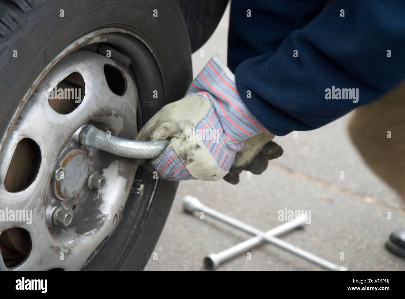 Man changing tire, close-up Stock Photo - Alamy