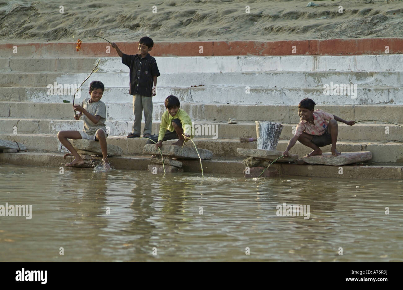 Children fishing along the Ganges River in Varanasi, India Stock Photo ...