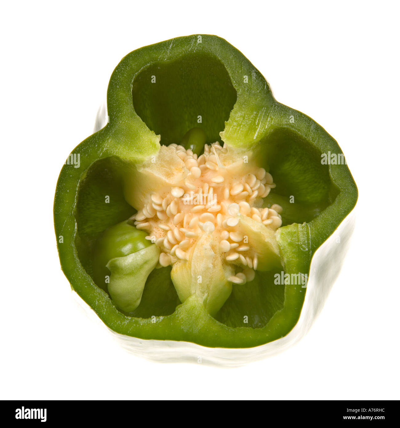 Green pepper cut open to display seeds on white background Stock Photo ...