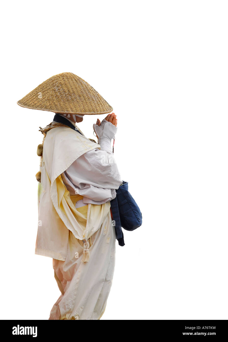 Cutout against a white background of a Japanese wandering monk offering ...