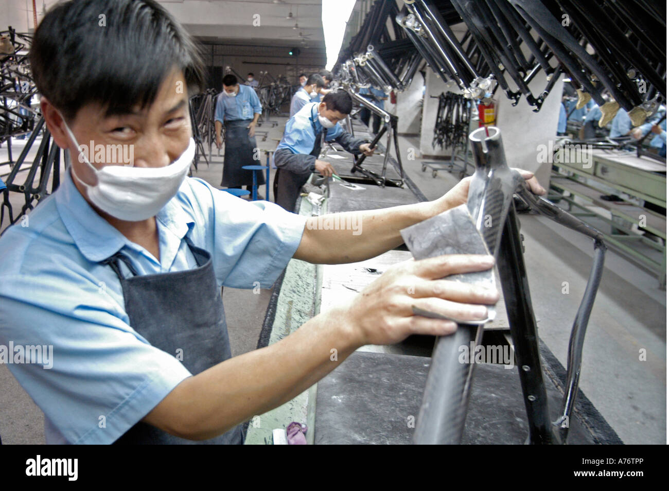 Worker grinding in a carbon bicycle factory, Martec, China Stock Photo ...