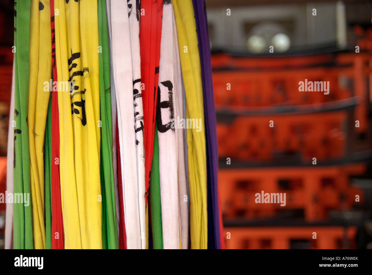 Clutch of colourful fabric banners hanging at a shrine with named ...