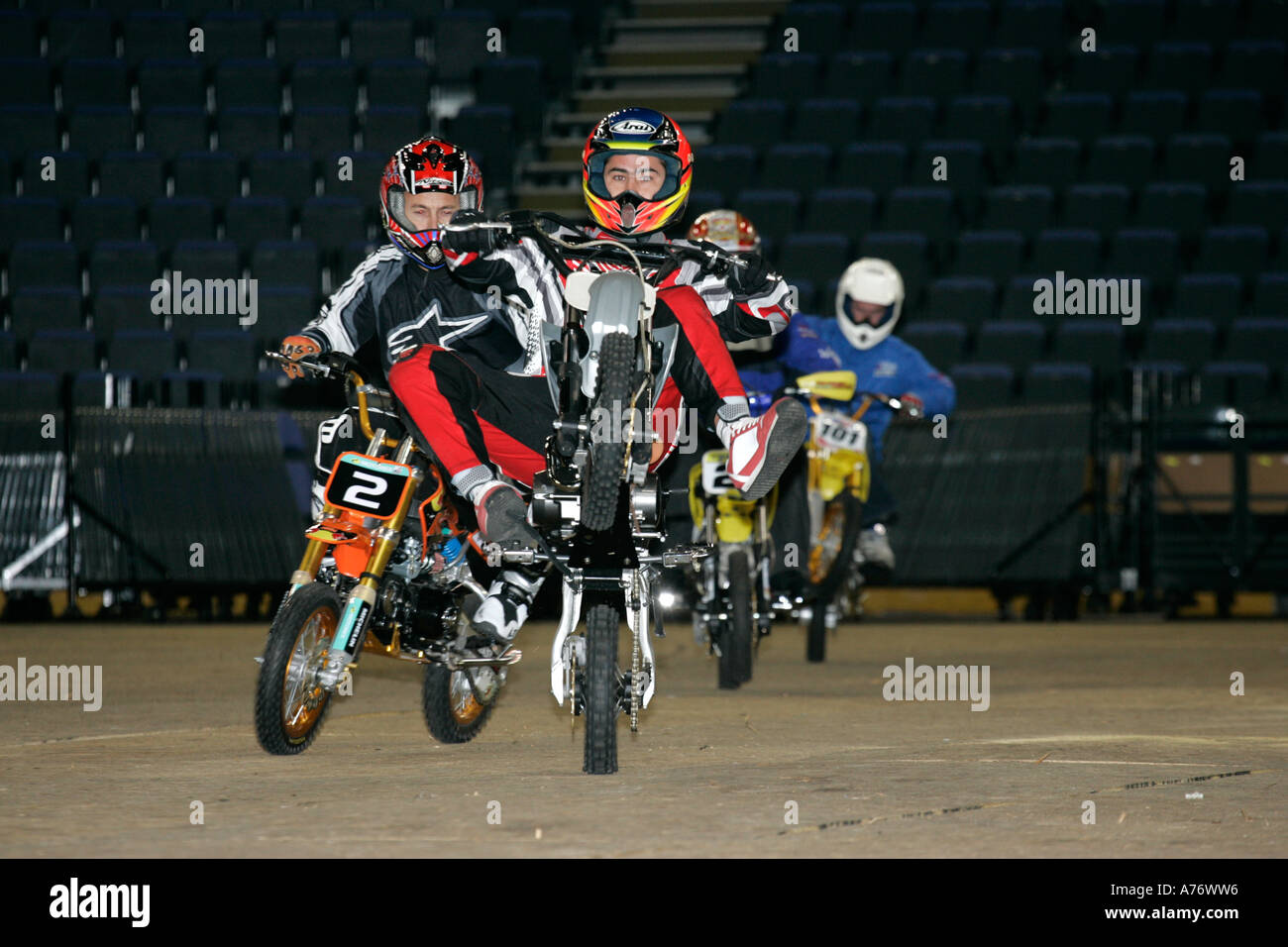 riders perform wheelies at the launch of the indoor motocross Odyssey ...