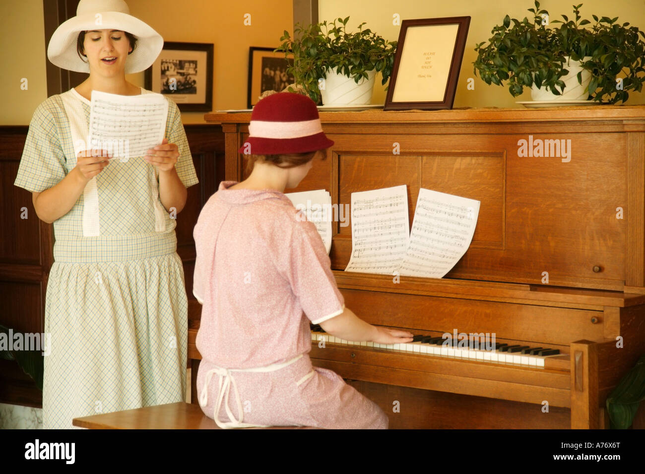 Women playing piano and singing Stock Photo - Alamy