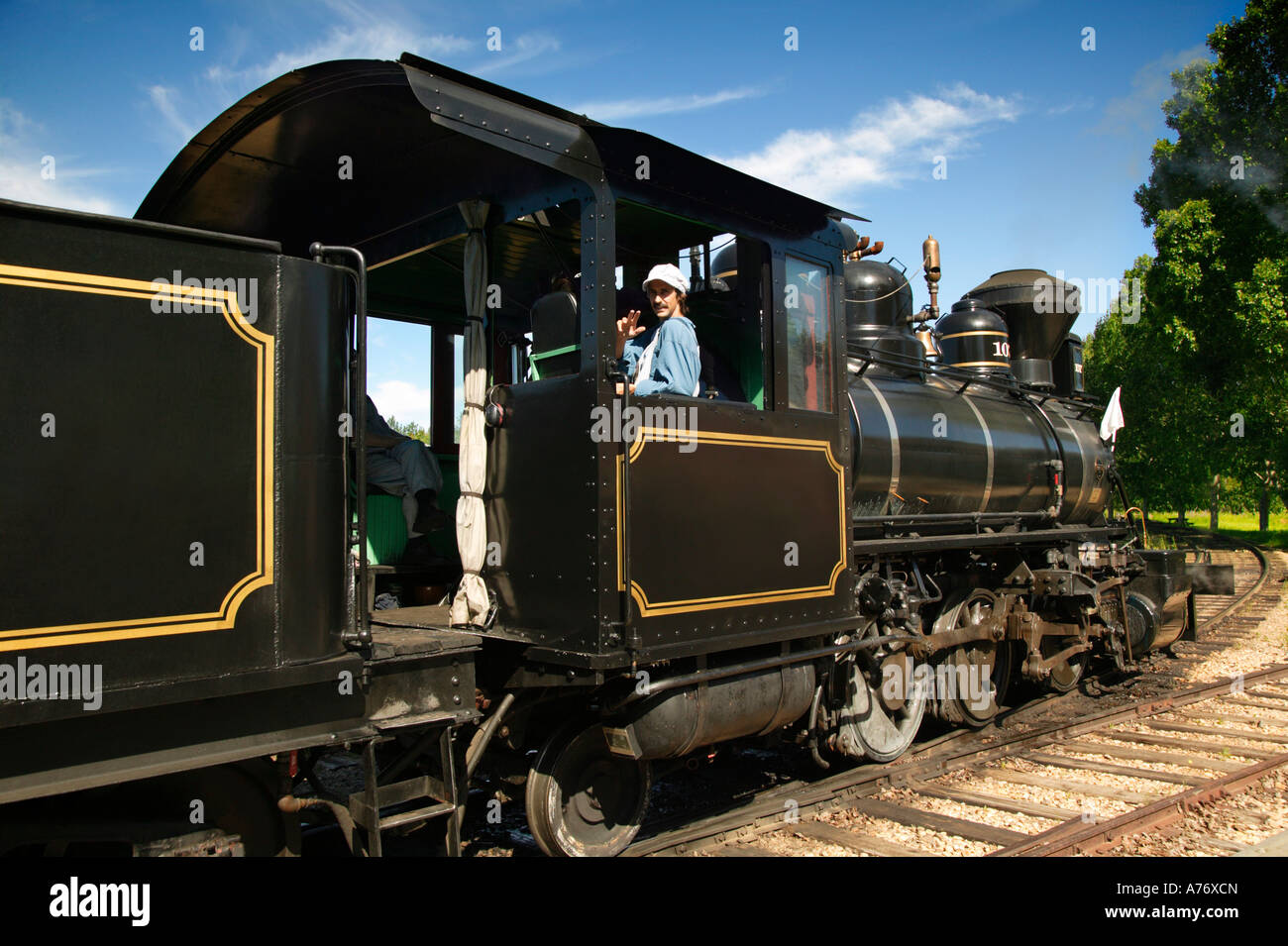 Old fashioned train and conductor Stock Photo - Alamy