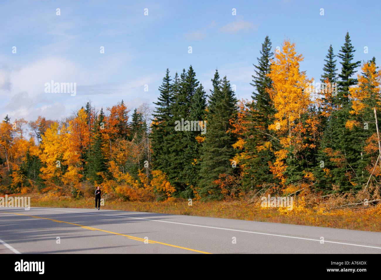 Person running on a highway Stock Photo - Alamy