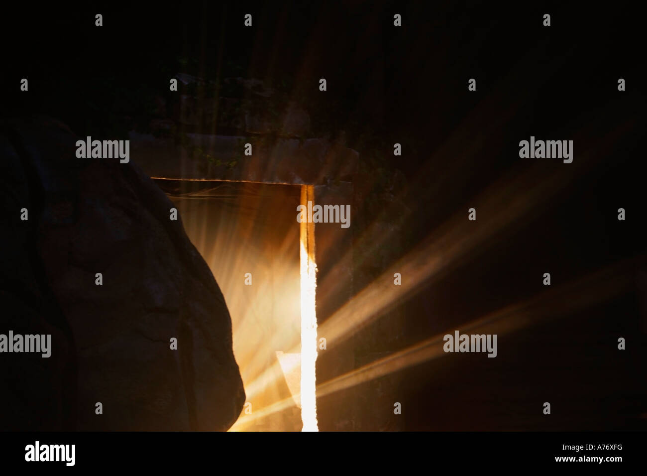 Light emerging from behind a tombstone Stock Photo - Alamy