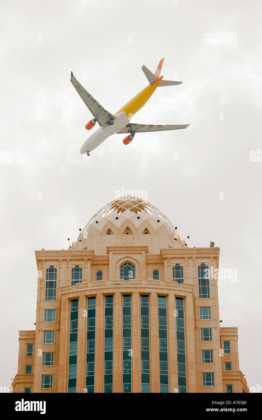 Airplane above high-rise building, Doha, Qatar, United Arab Emirates ...