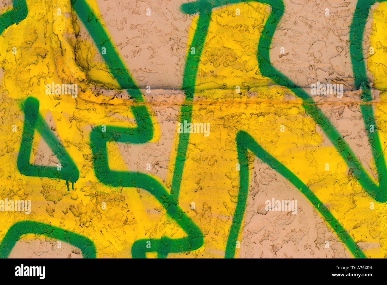 Wall painting yellow green graffiti street art on wall Stock Photo - Alamy