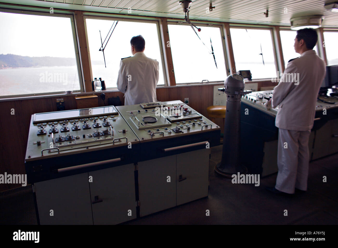 CHINA YANGTZE RIVER Crew members in the bridge of a Chinese Cruise ship ...