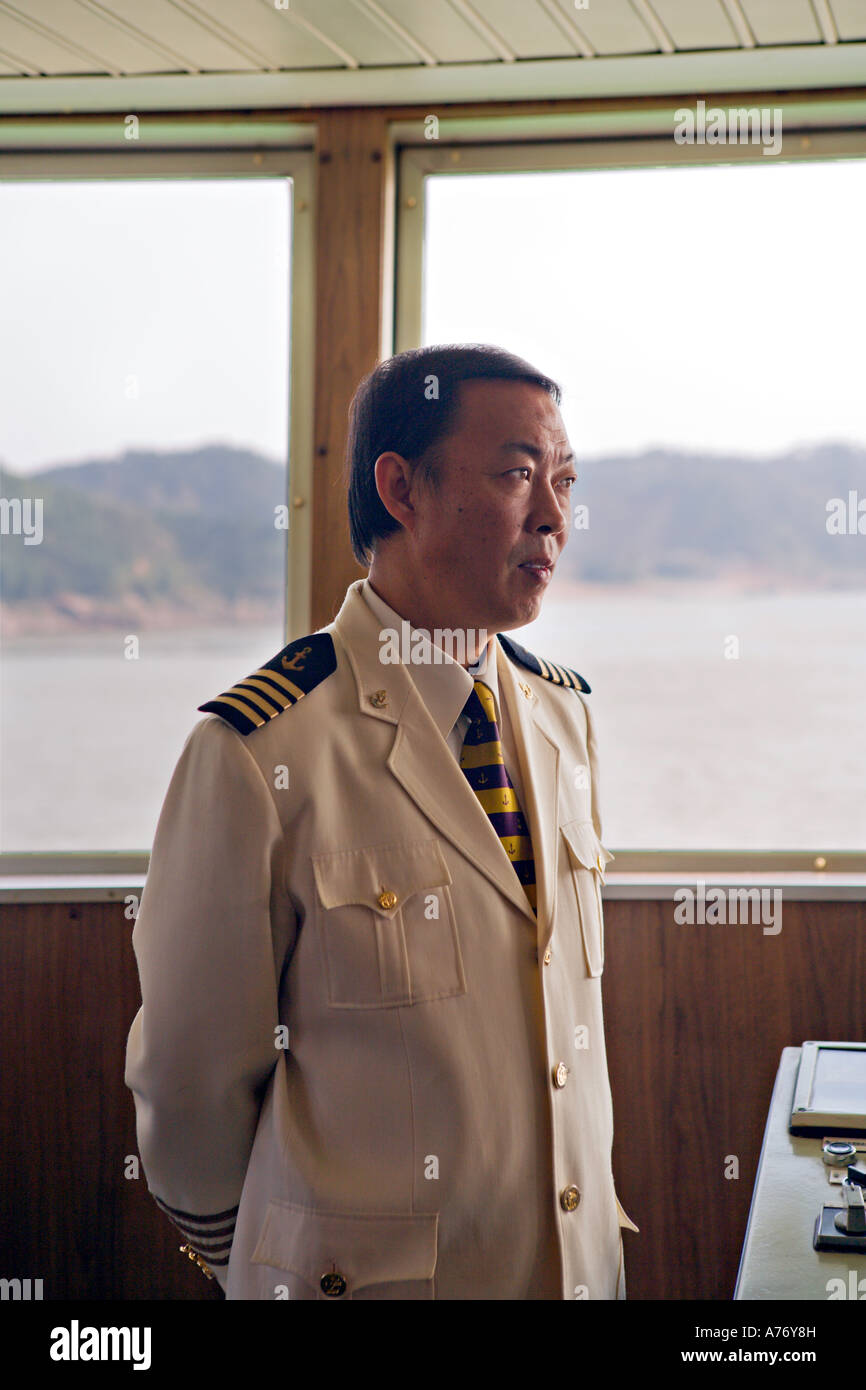 CHINA YANGTZE RIVER Proud captain in the bridge of his Chinese Cruise ...