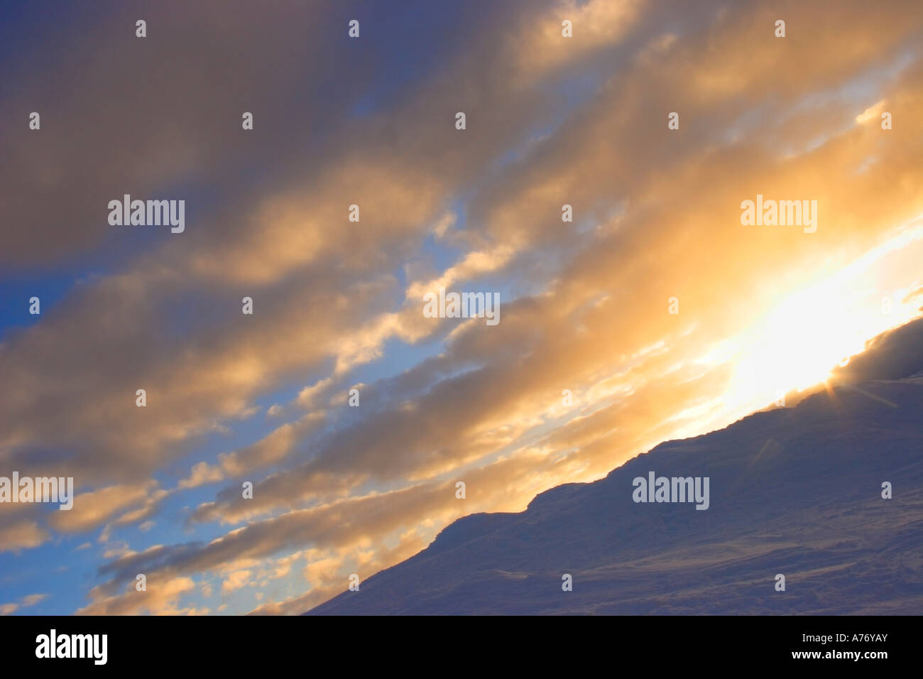 Sunlight through clouds Stock Photo - Alamy