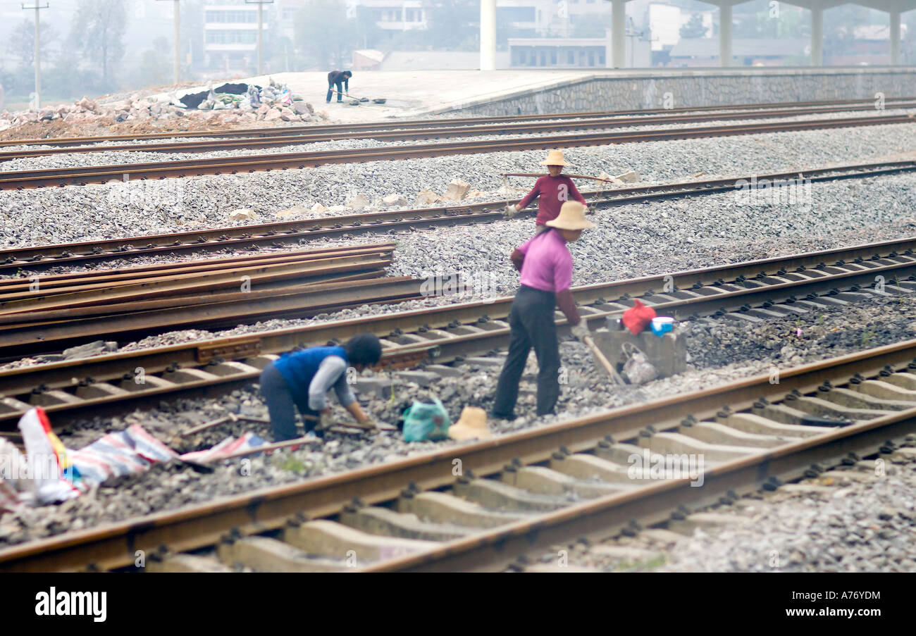 CHINA SHANGHAI Female Chinese railroad workers in traditional straw hat ...