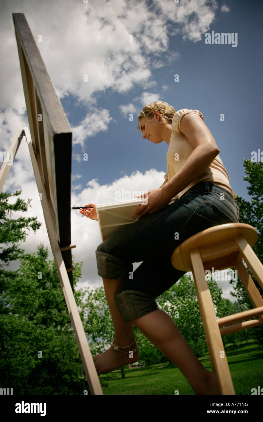 Artist painting on canvas Stock Photo - Alamy