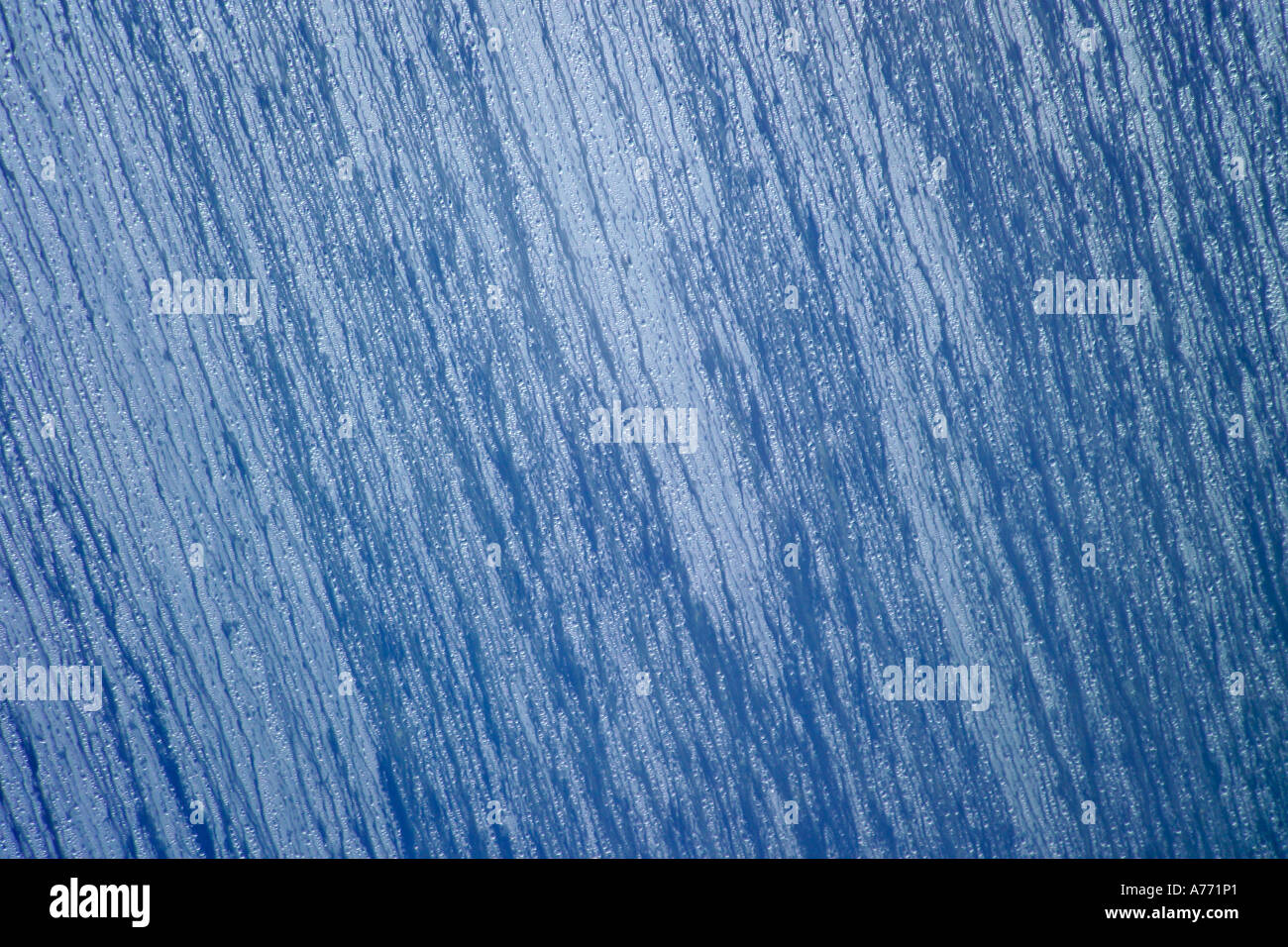 Close up of rain streaming down a window Stock Photo - Alamy