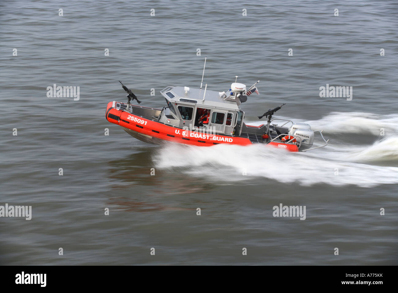 armed coast guard boat monitors staten island ferry on hudson river ...
