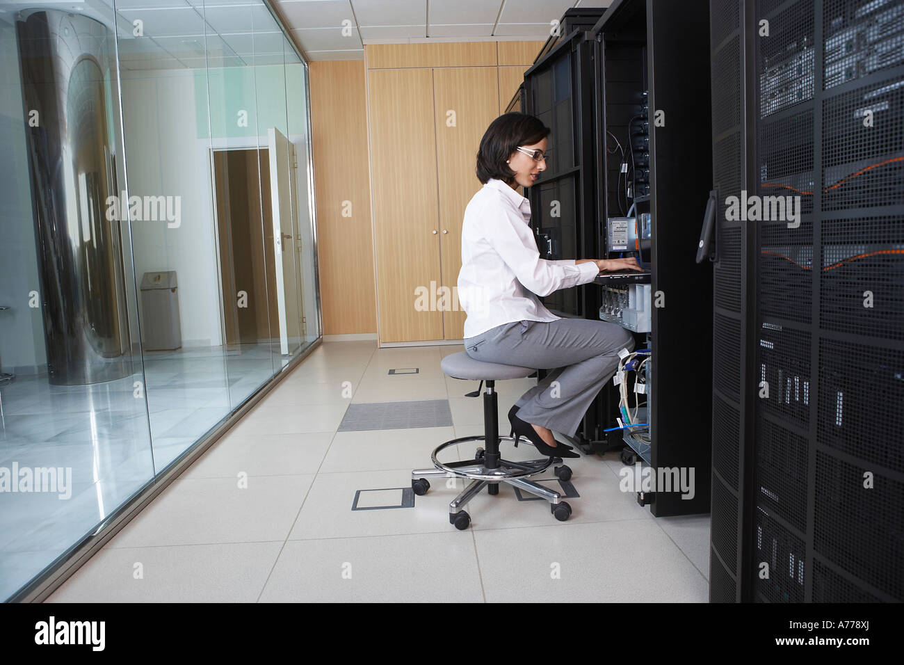 Sitting in server room woman hi-res stock photography and images - Alamy