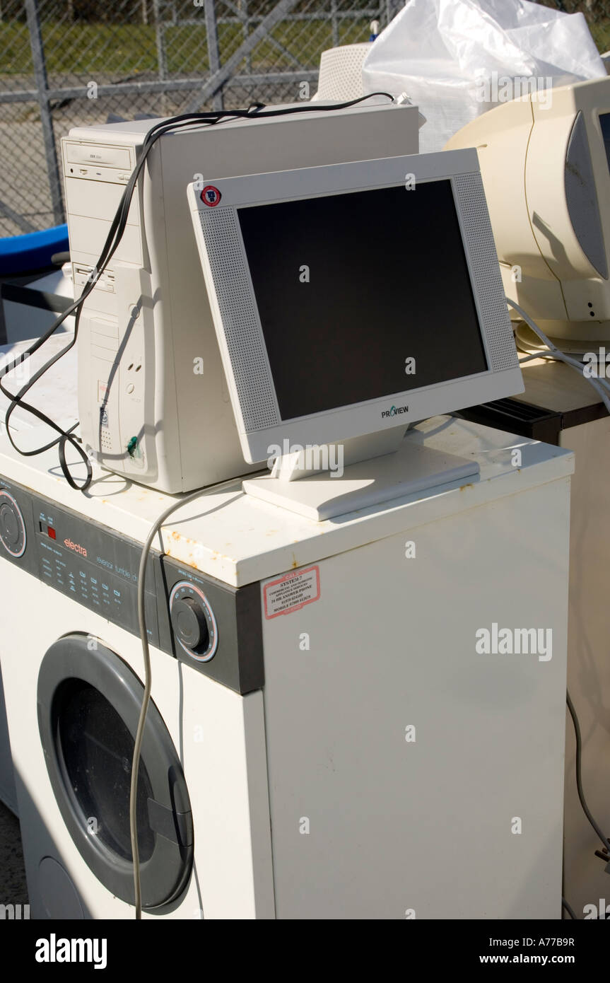 Computer flat screen monitor and washing machine at community recycling ...