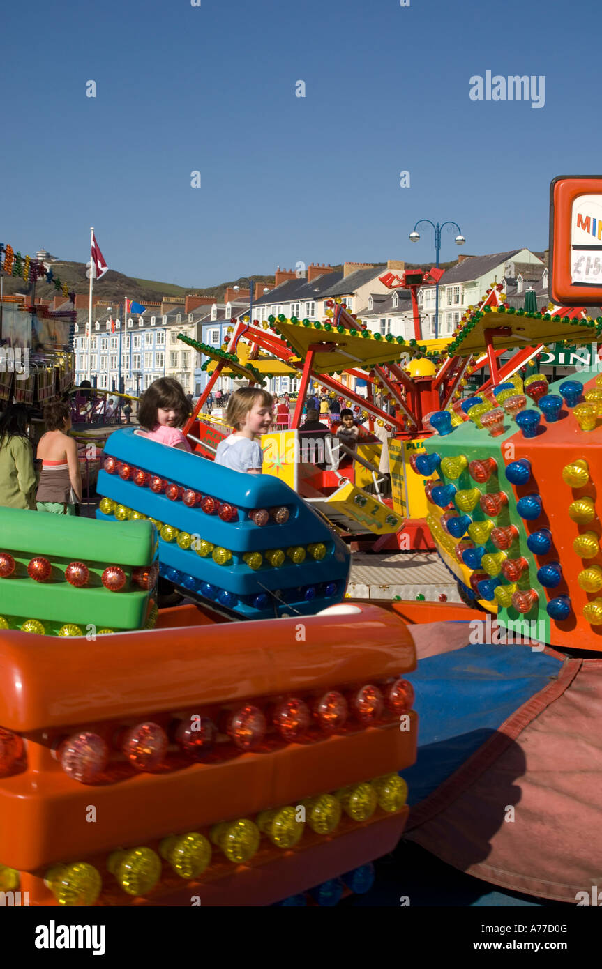 kids on a funfair ride fairground on the promenade Aberystwyth Wales UK ...