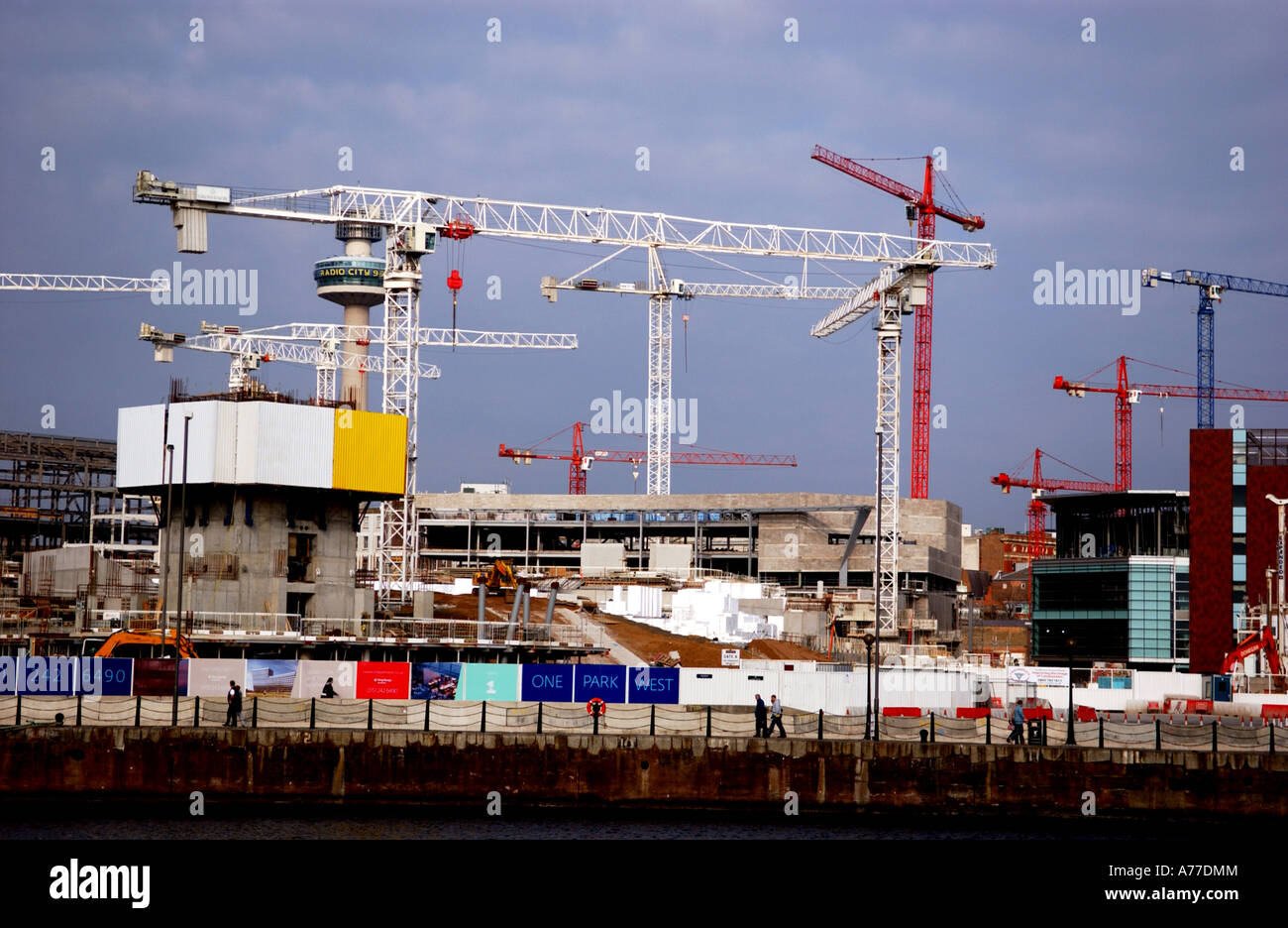 Cranes dominate the skyline in Liverpool city centre UK where a massive ...
