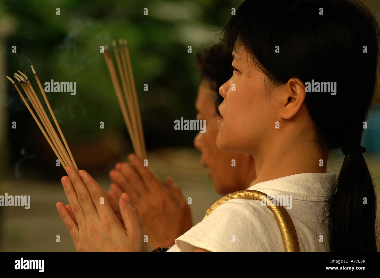 Malaysian Ethnic Chinese praying in a buddhsit temple in Kuala Lumpur ...