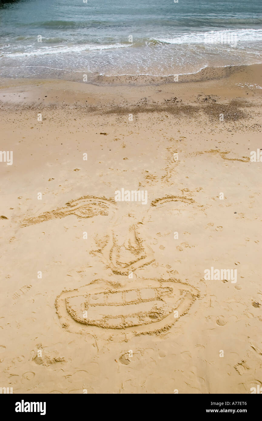 Face drawn in sand, Southwold Beach, Suffolk, UK Stock Photo - Alamy