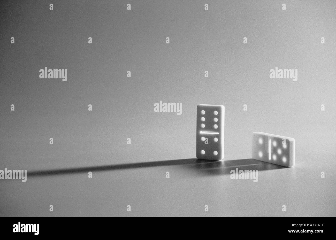 Two Dominoes alone Stock Photo - Alamy