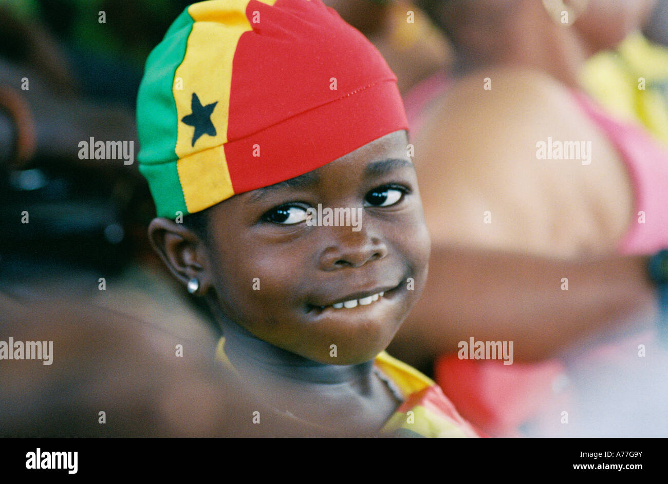 Smiling African girl, wearing a cap Stock Photo - Alamy