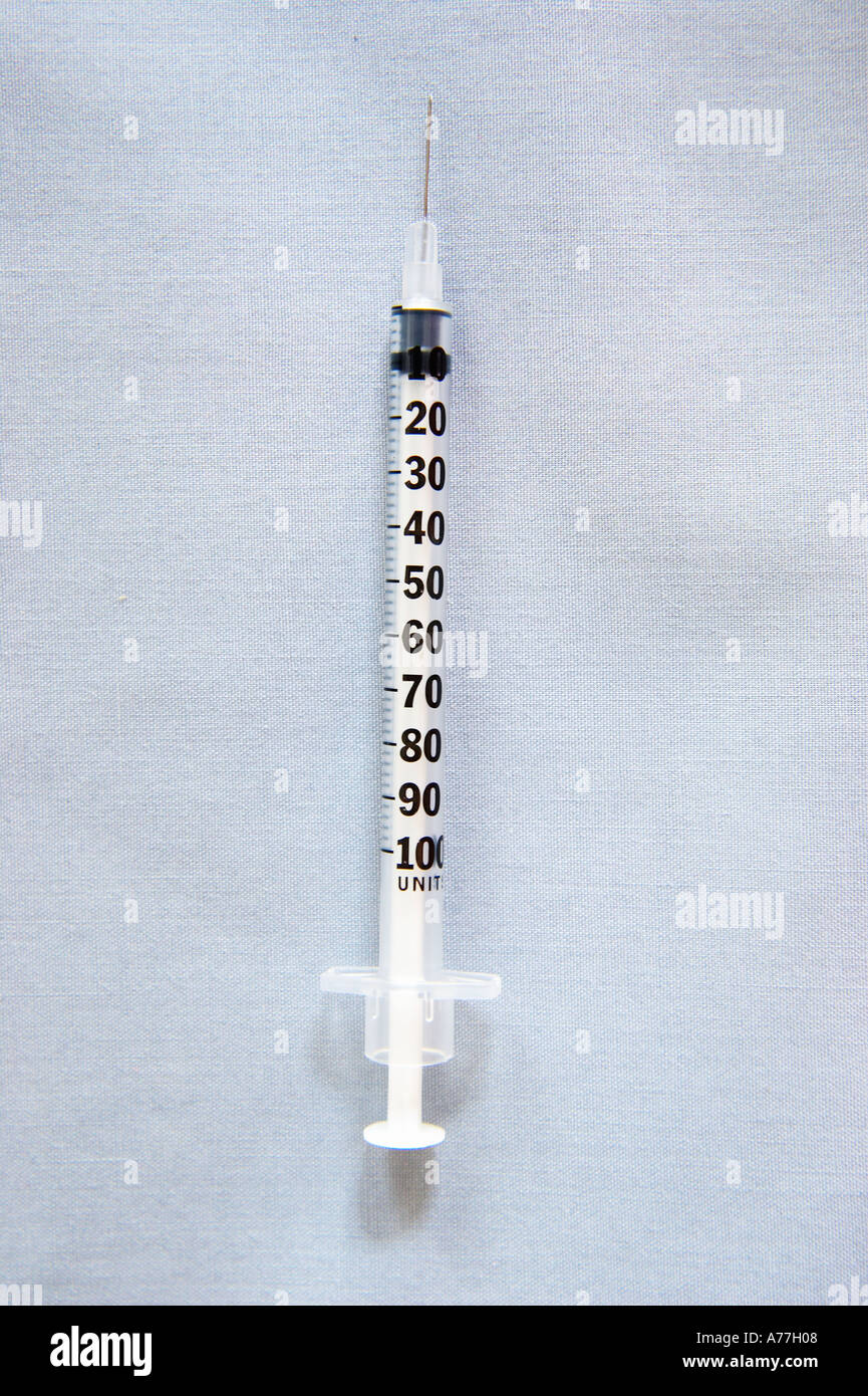 Insulin syringe on white cloth background Stock Photo - Alamy