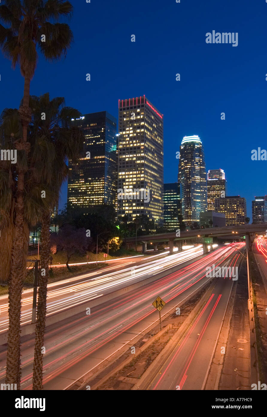Rush hour traffic on the 110 freeway with Los Angeles skyline ...