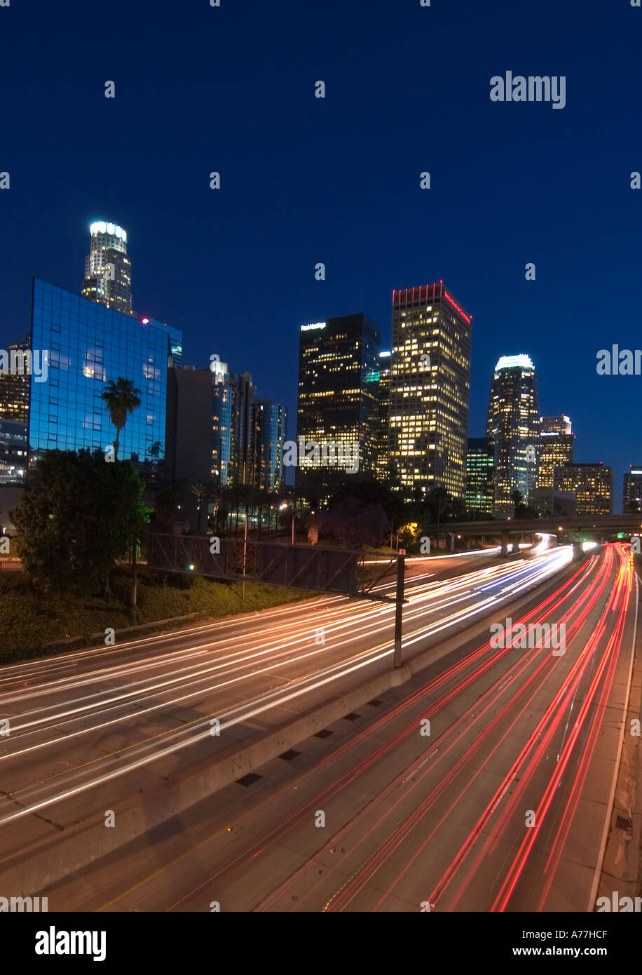 Rush hour traffic on the 110 freeway with Los Angeles skyline ...