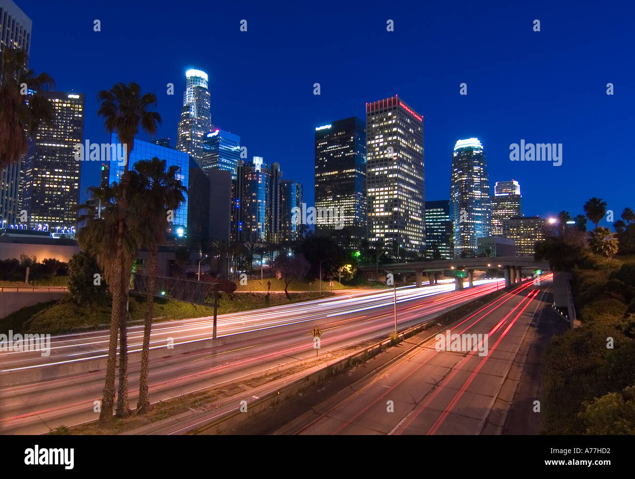 Rush hour traffic on the 110 freeway with Los Angeles skyline ...