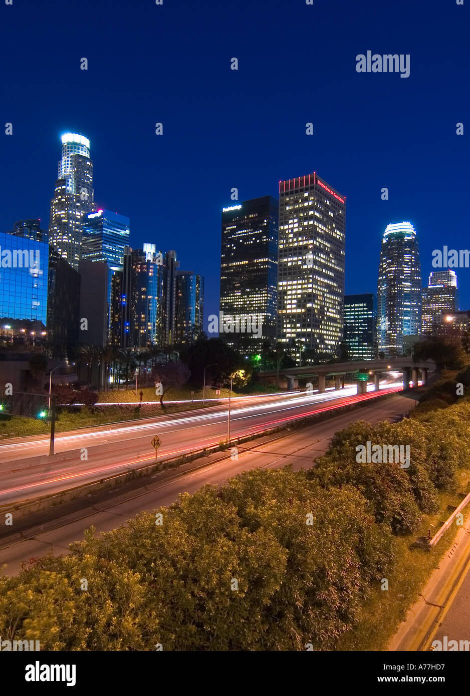 Rush hour traffic on the 110 freeway with Los Angeles skyline ...