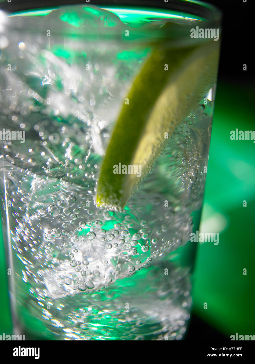 gin and tonic with ice and a slice Stock Photo - Alamy