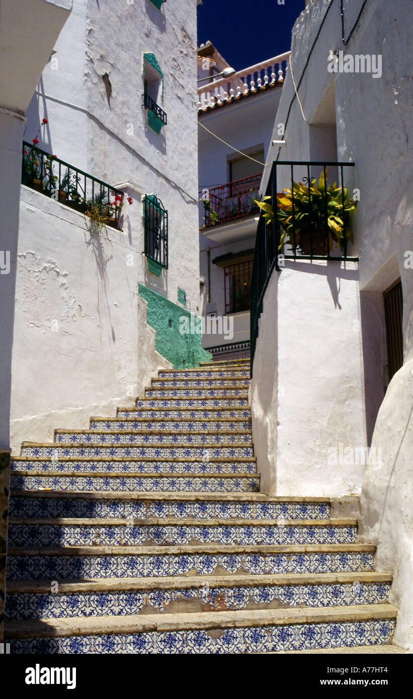 Traditional tiled steps leading up through white houses Stock Photo - Alamy