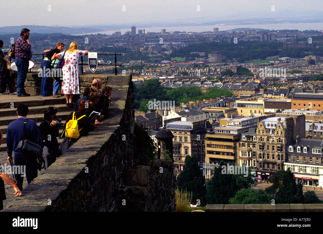 Tourist overlooking Edinburgh from the castle walls Stock Photo - Alamy