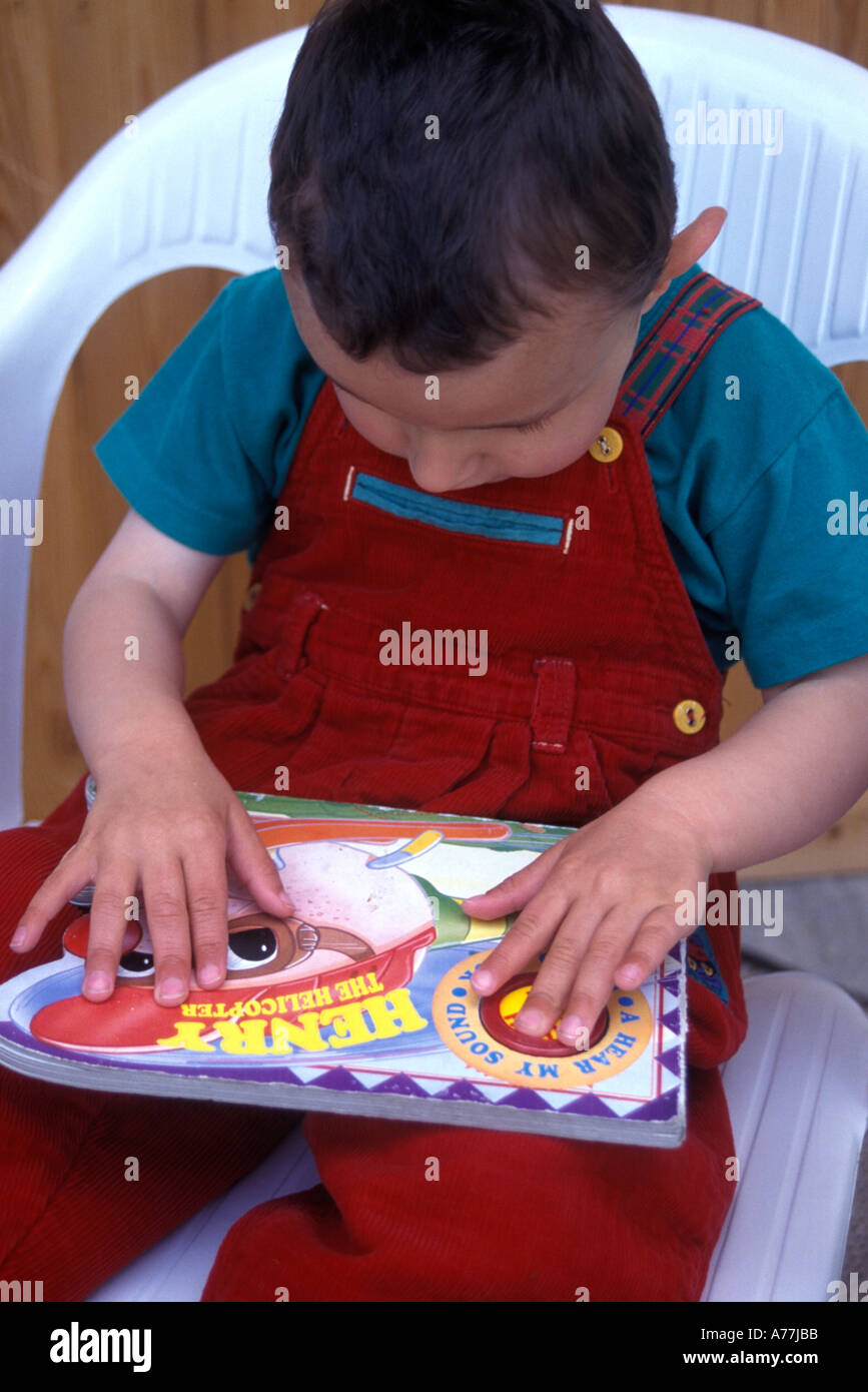 blind boy playing with sound book Stock Photo - Alamy