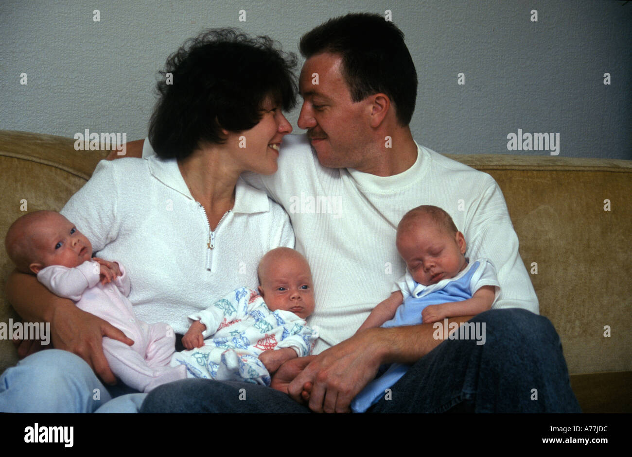 couple with triplets Stock Photo - Alamy