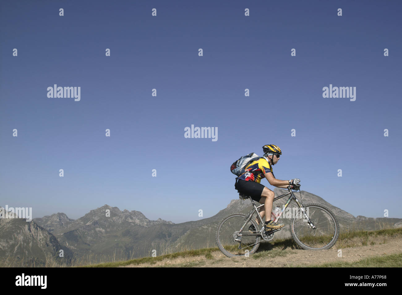 Mountain Biker riding Uphill Stock Photo - Alamy